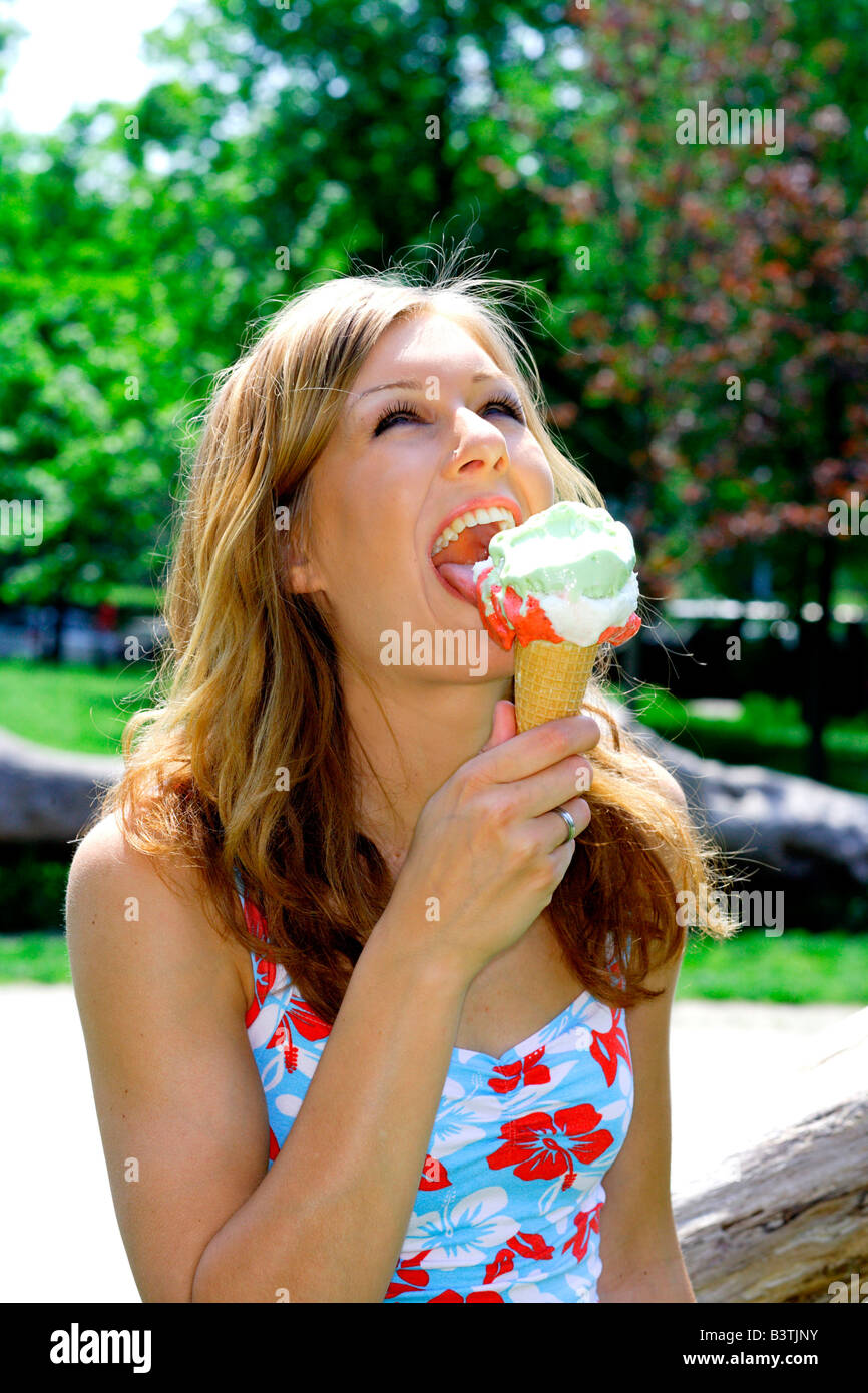 Young woman with a cookie Stock Photo - Alamy