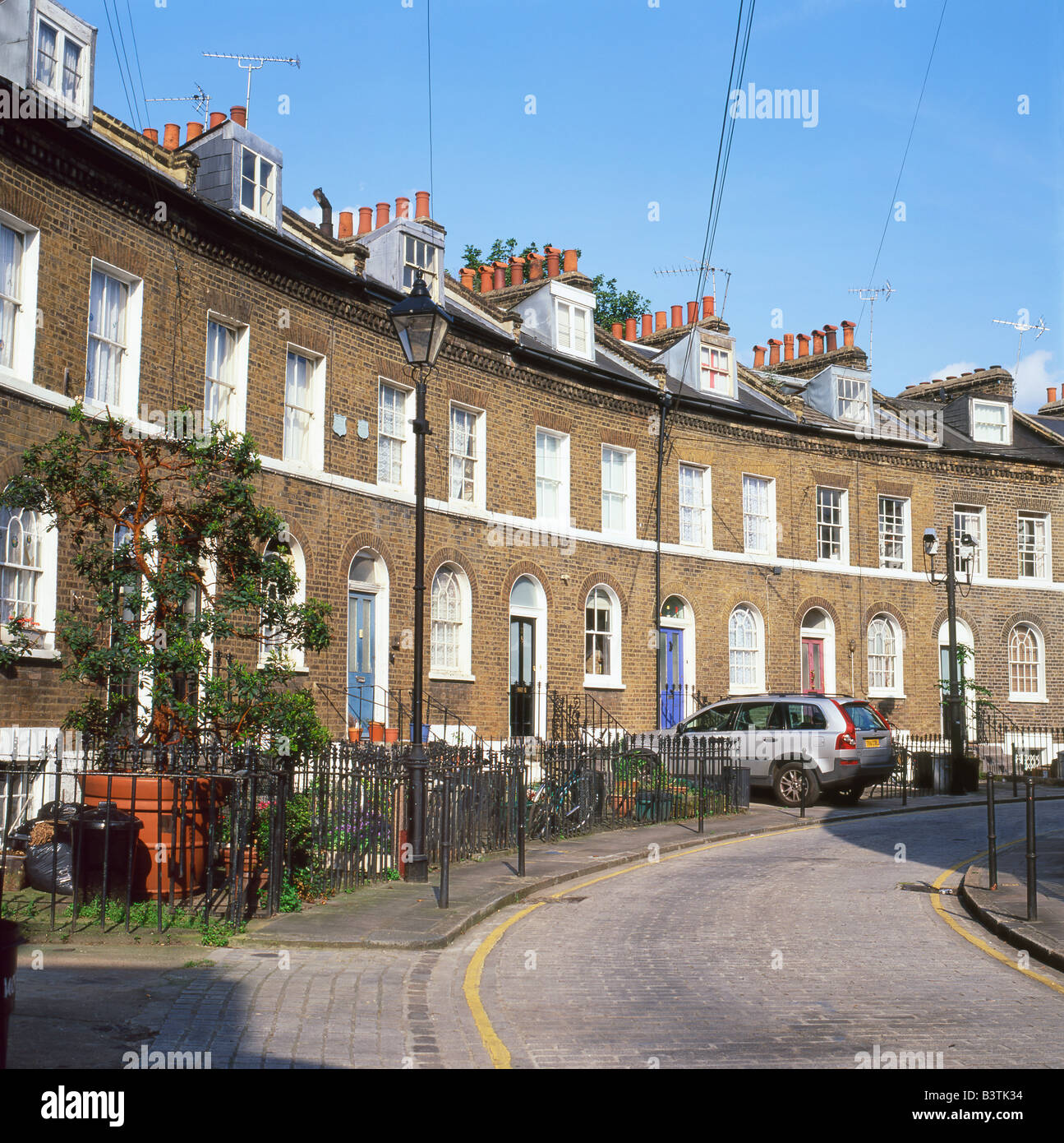 A row of traditional terraced brick houses housing at Keystone Crescent ...