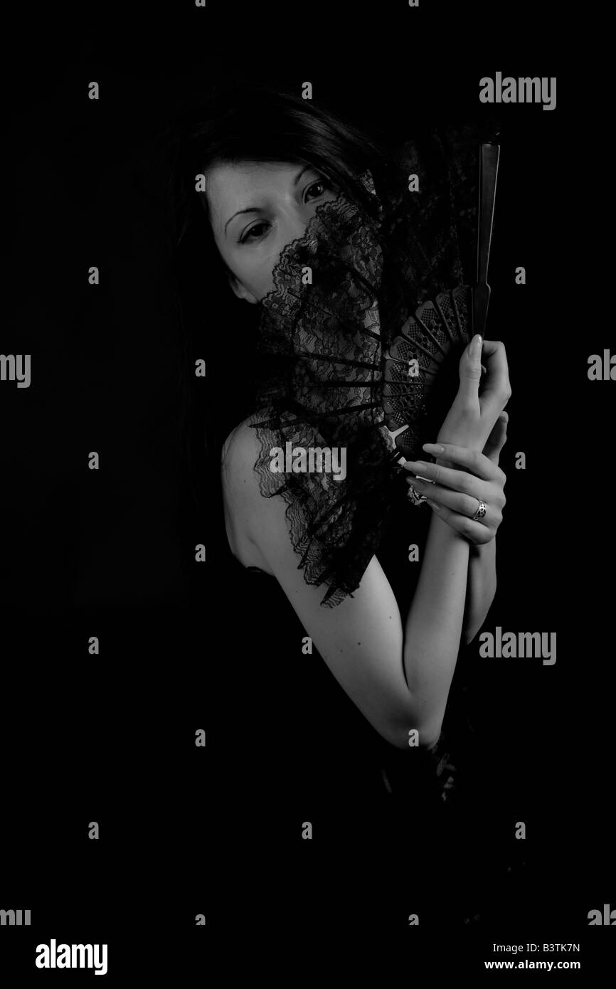 portrait of a young woman with fan Stock Photo - Alamy