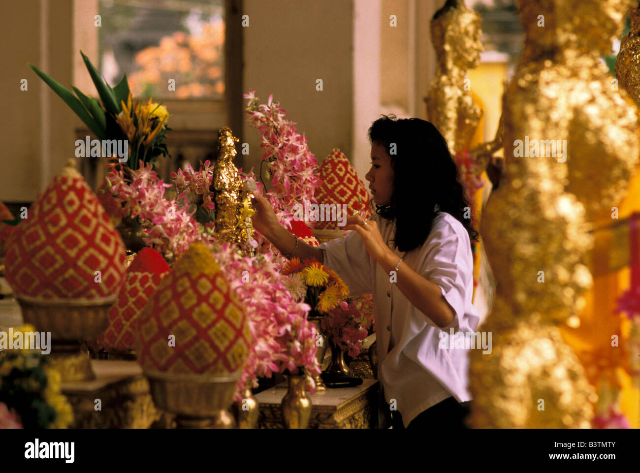 Asia, Thailand. Making temple offerings Stock Photo - Alamy