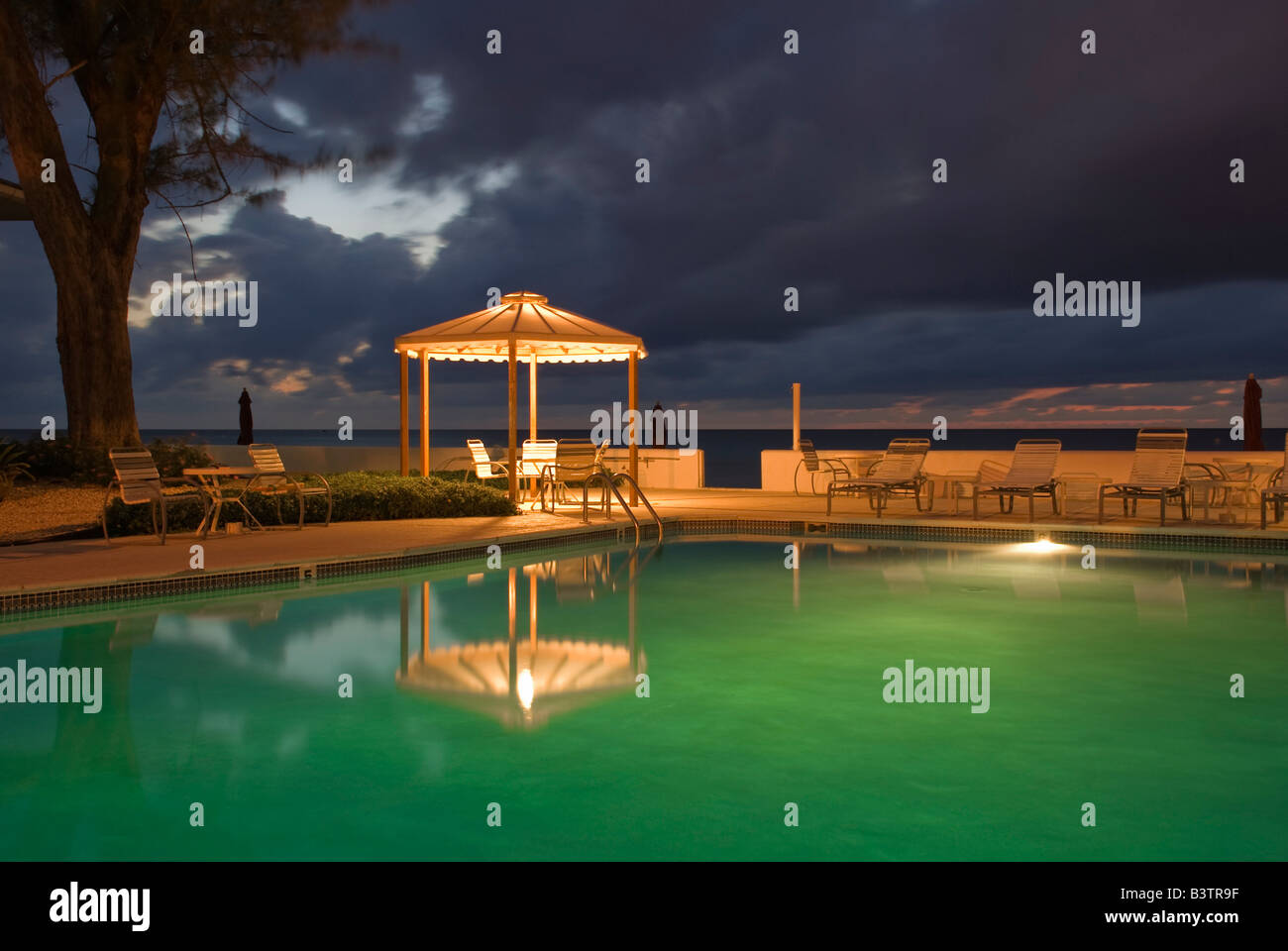 Caribbean Sea, Cayman Islands. A resort pool at night Stock Photo - Alamy