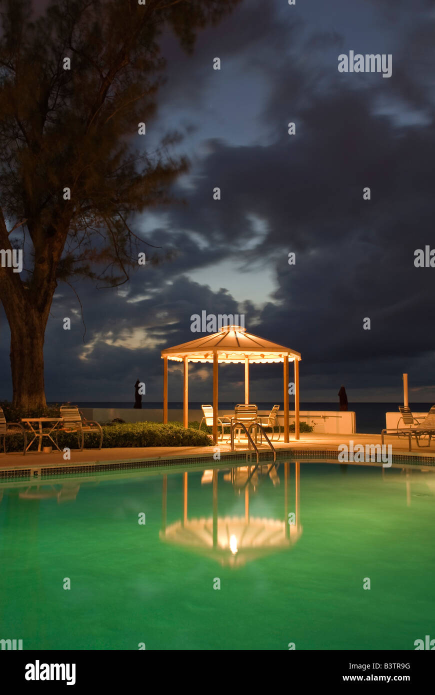Caribbean Sea, Cayman Islands. A resort pool at night Stock Photo - Alamy