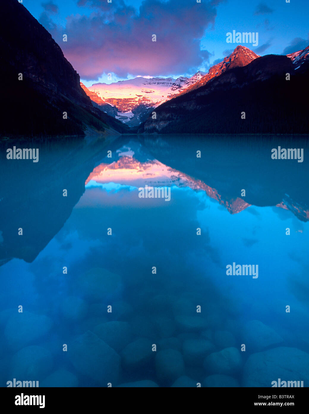 Canada, Alberta, Banff National Park. Sunrise reflects Victoria Glacier ...