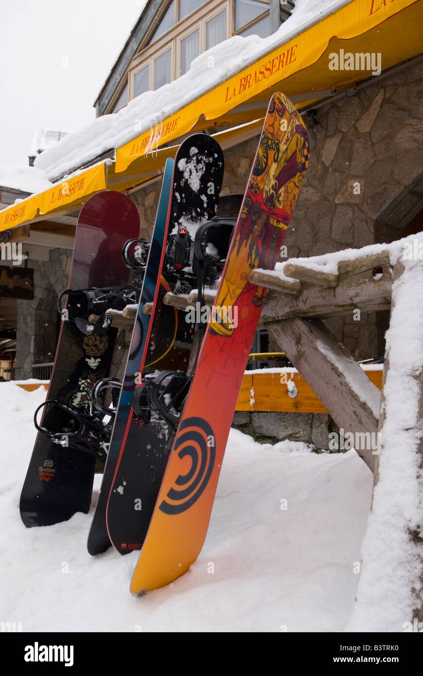 CA, BC, Whistler Village. Snowboards outside cafe in fresh snow Stock ...