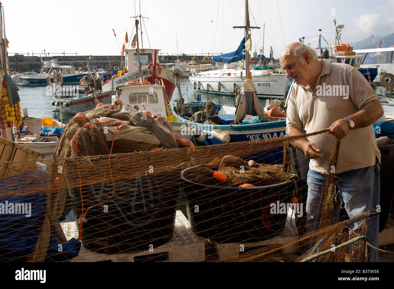 Fisherman in boat inspects hi-res stock photography and images - Alamy
