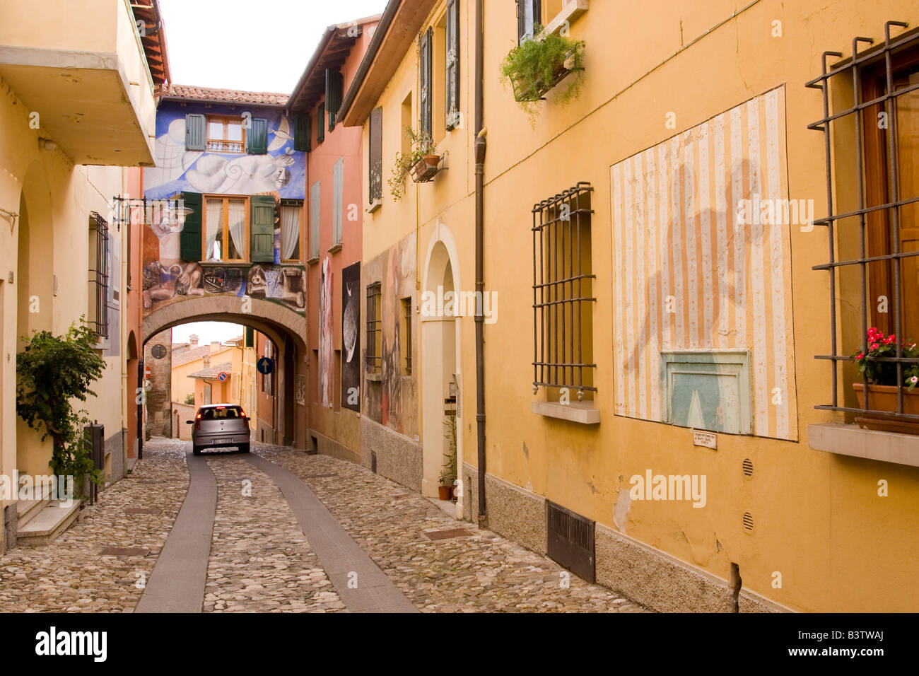 Europe, Italy, Dozza. Mural decorations on one of three main streets in ...