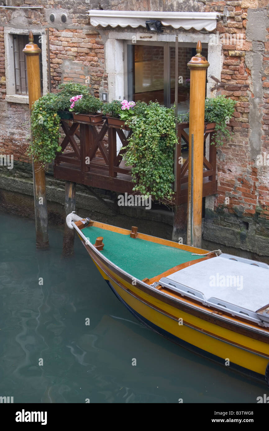 Europe, Italy, Venice. Boat tied to dock at building entrance Stock ...