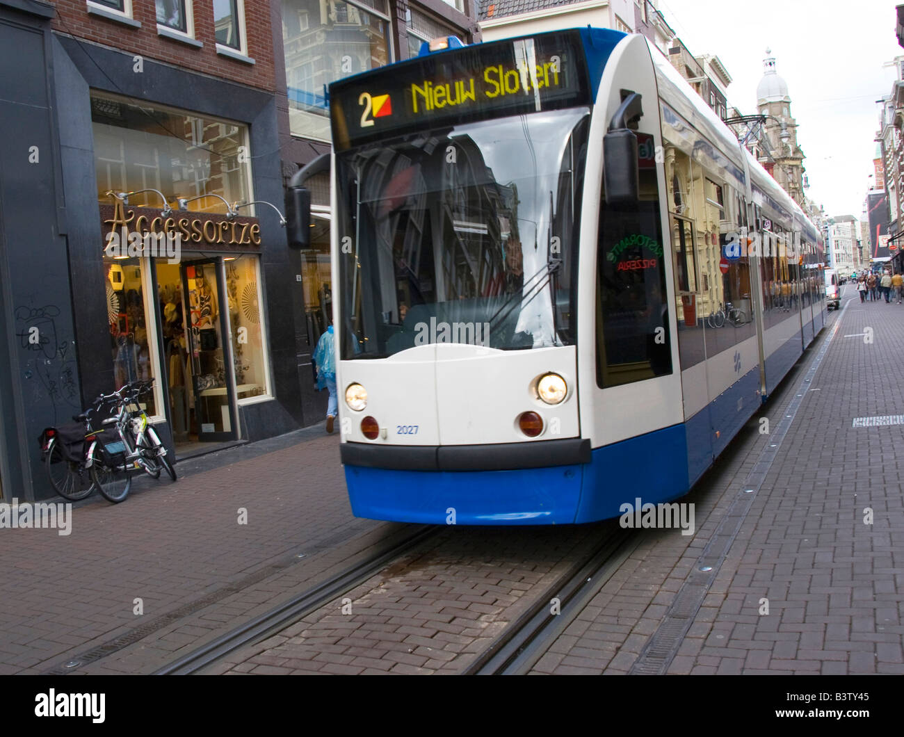 Amsterdam street scene with a close up tram on a track Stock Photo - Alamy