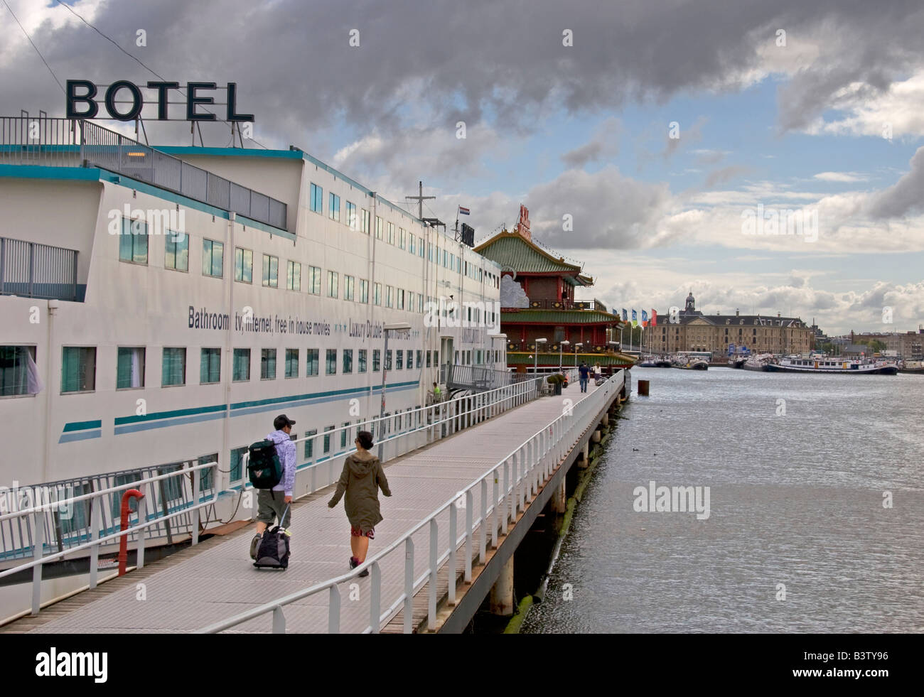 Amstel Botel a floating hotel in the Amsterdam Harbour with tourist ...