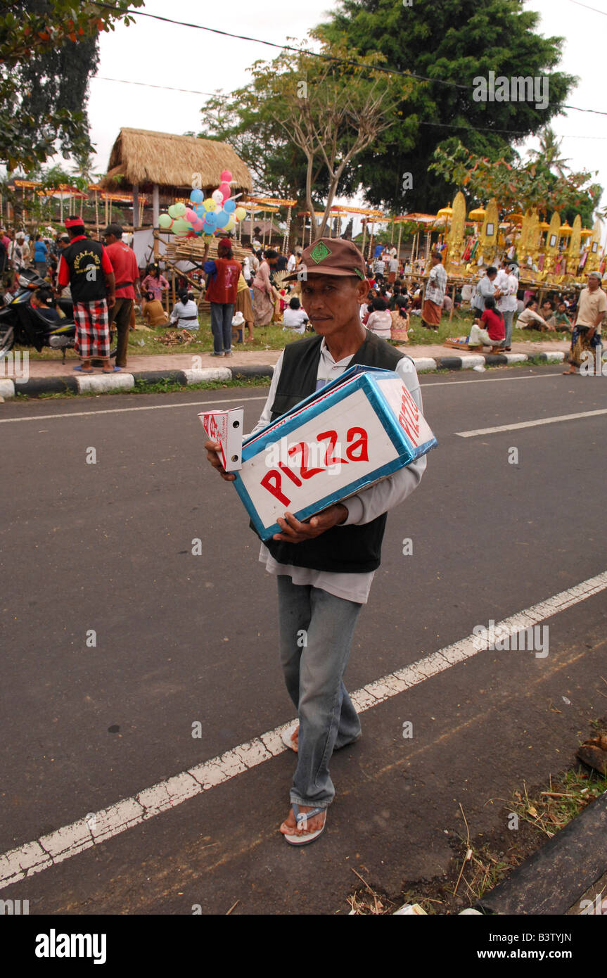 selling pizza's at funeral procession , mass cremation ,gianyar ...