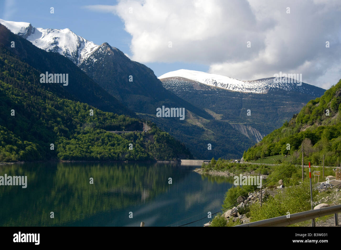 Spain, Catalonia, Pyrenees Mountains. View of lake and dam from ...
