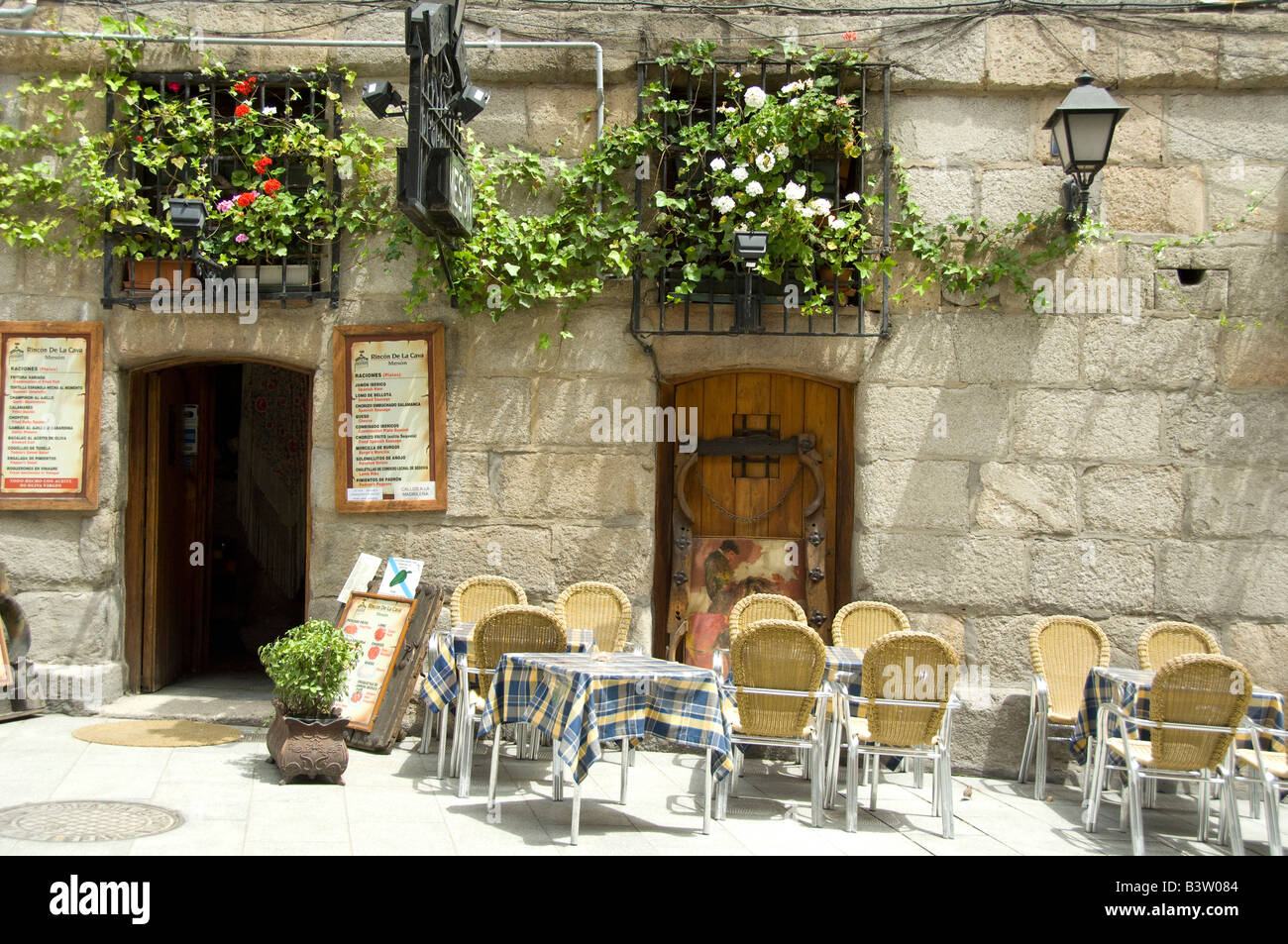 Spain, Madrid. Typical street scene in historic San Pedro area, cafe ...