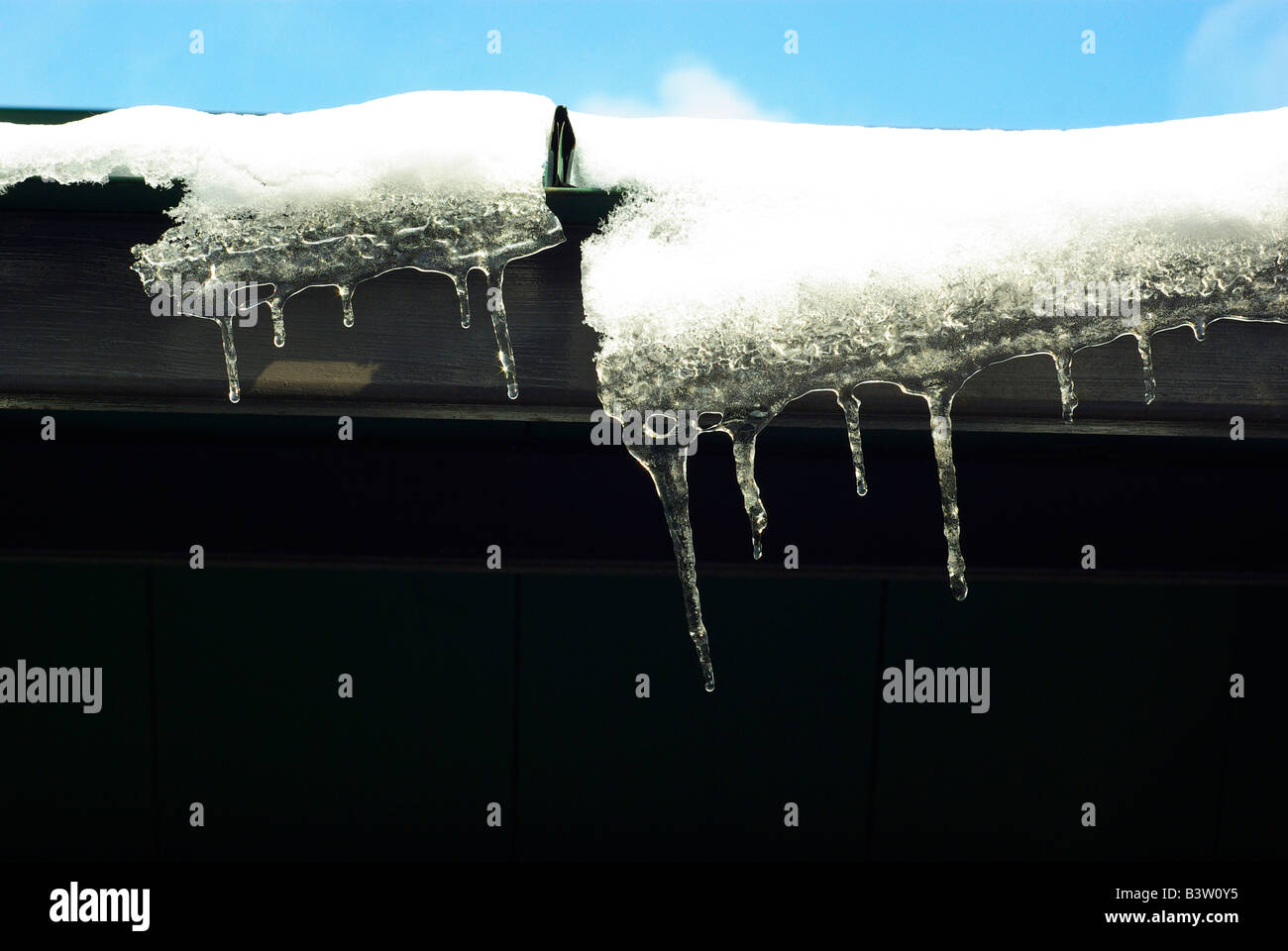 Icicles form from ice and snow melting atop a shade structure Stock ...