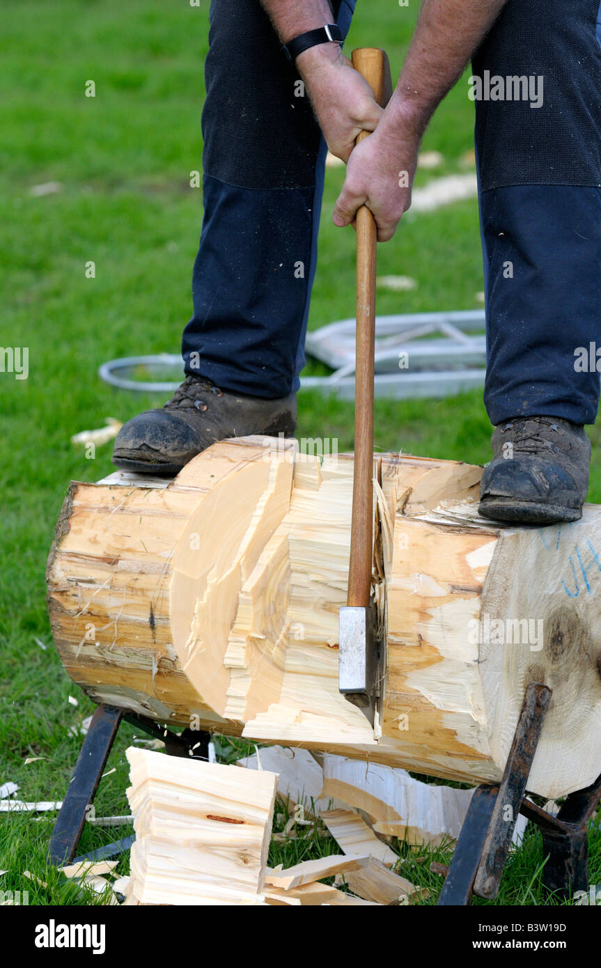Man chopping a log Stock Photo - Alamy
