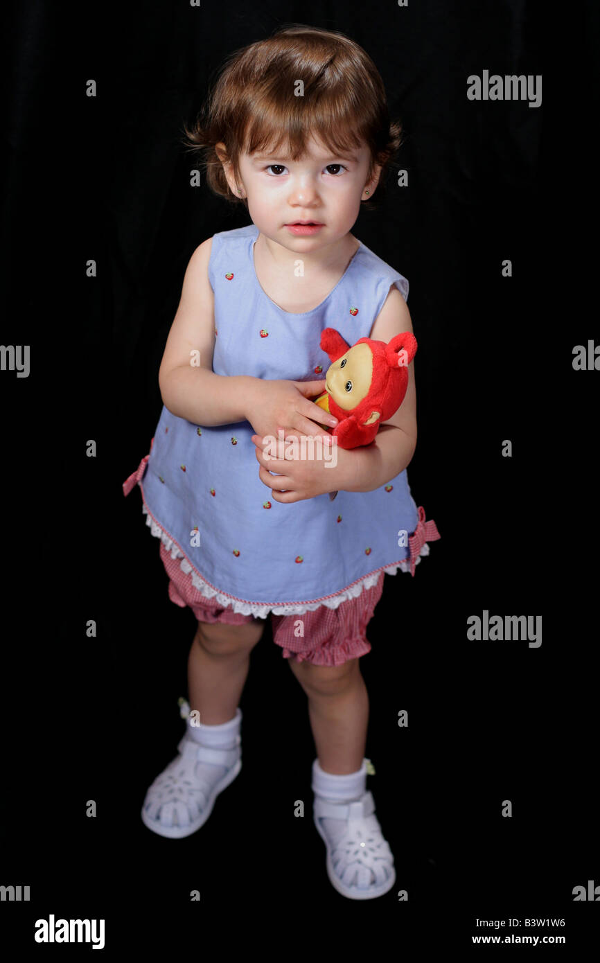 Portrait of a 1 year old toddler girl with an aggressive stance ...