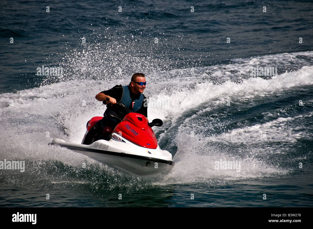 A speeding jetski on the sea Stock Photo - Alamy