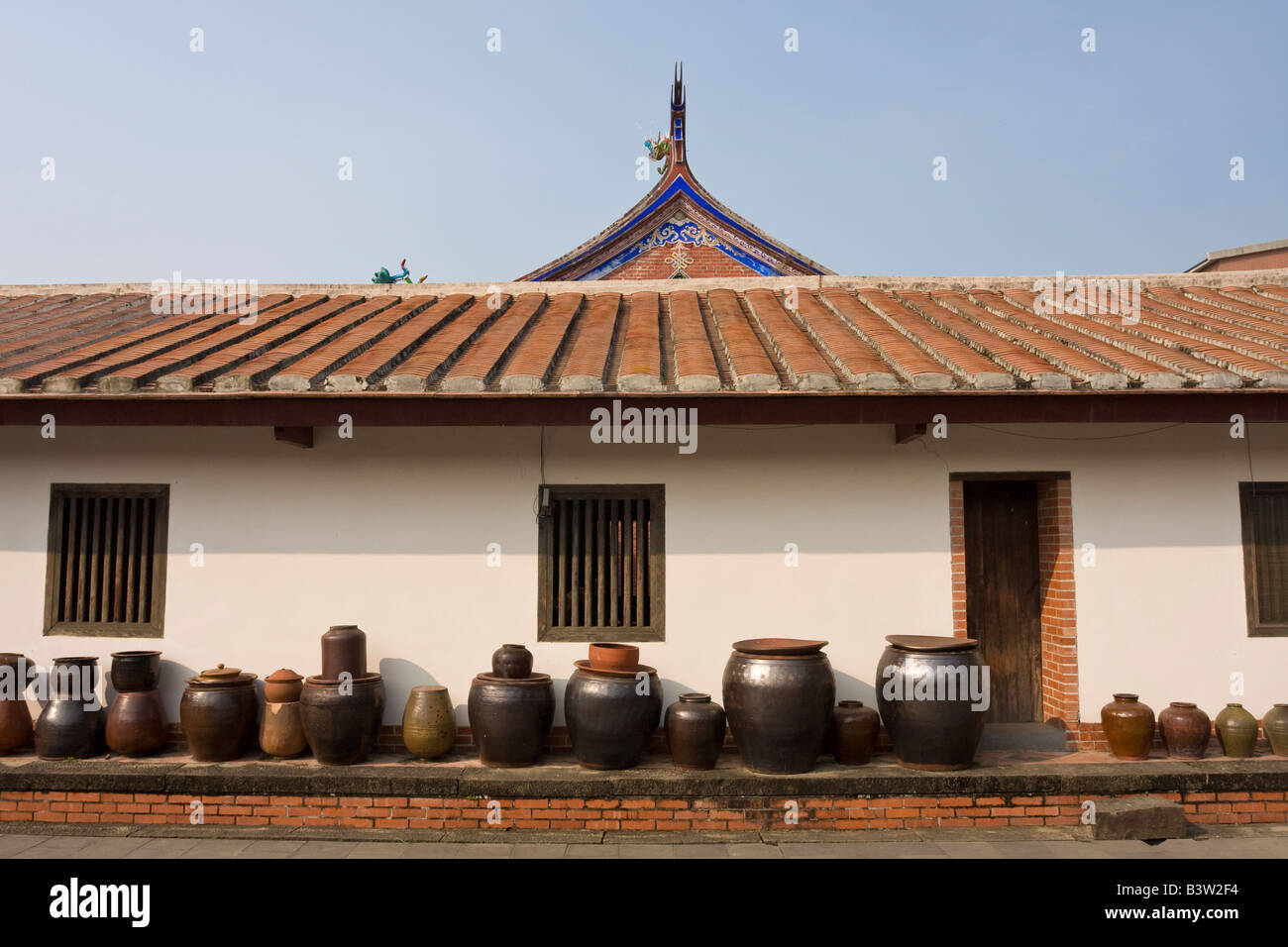Empty clay flower pots along a wall, Mingxin Academy, Jiji, Nantou ...