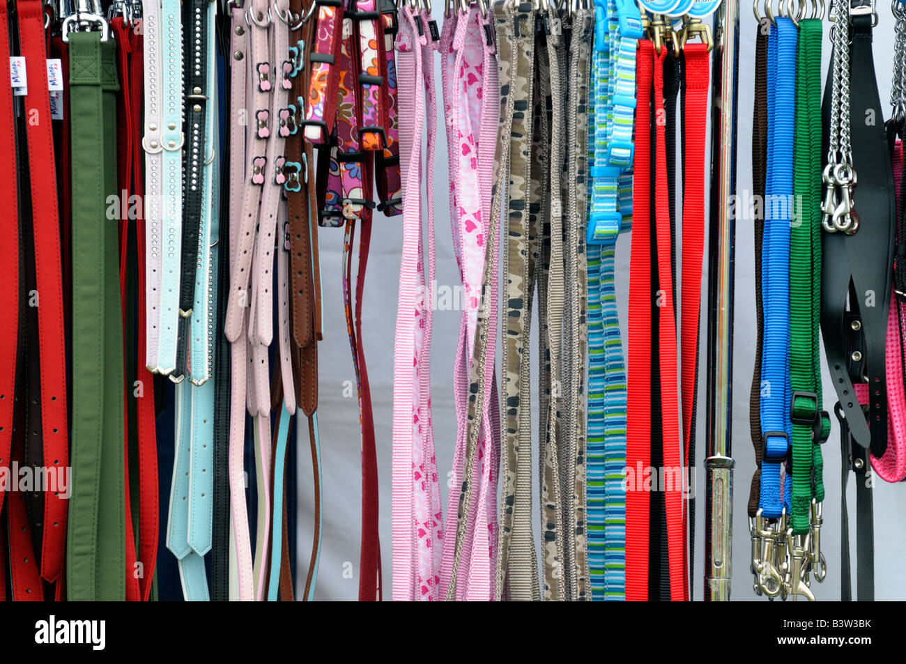 dog collars and leads displayed on a market stall Stock Photo - Alamy