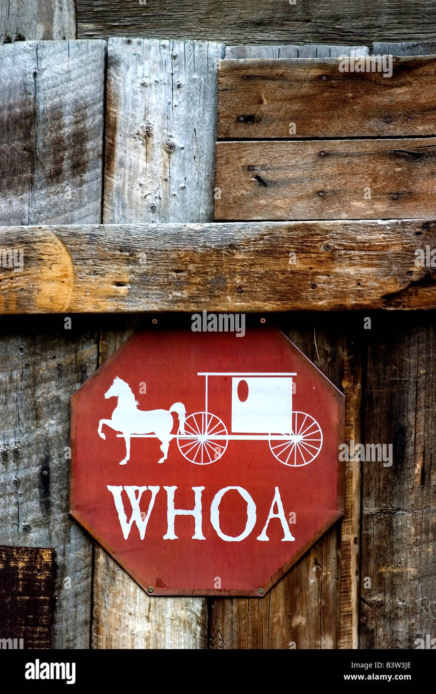 Humorous stop sign on side of barn Stock Photo - Alamy