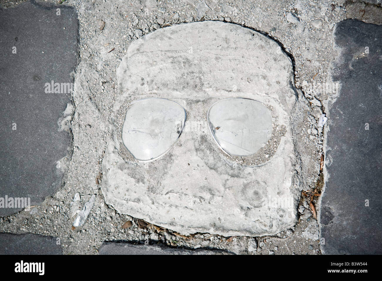 Glasses embedded in concrete Stock Photo - Alamy