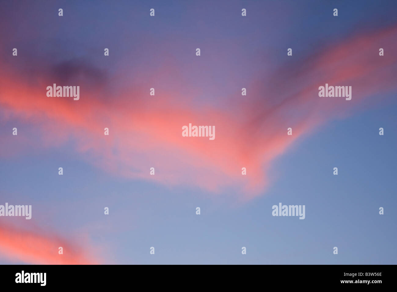 V shape orange cloud in the sky at sunset UK Stock Photo - Alamy