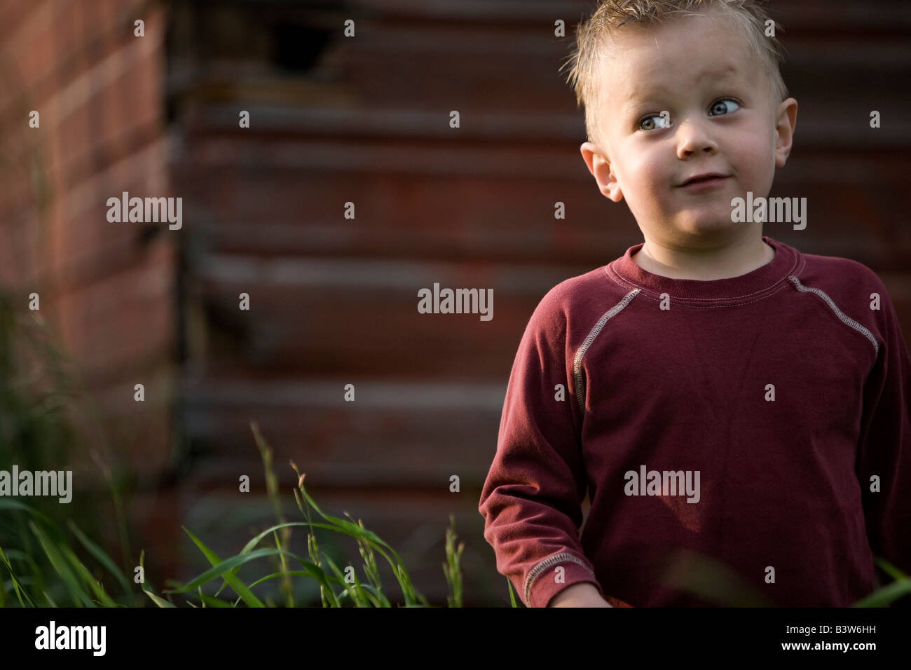 A young boy with silly expression Stock Photo - Alamy