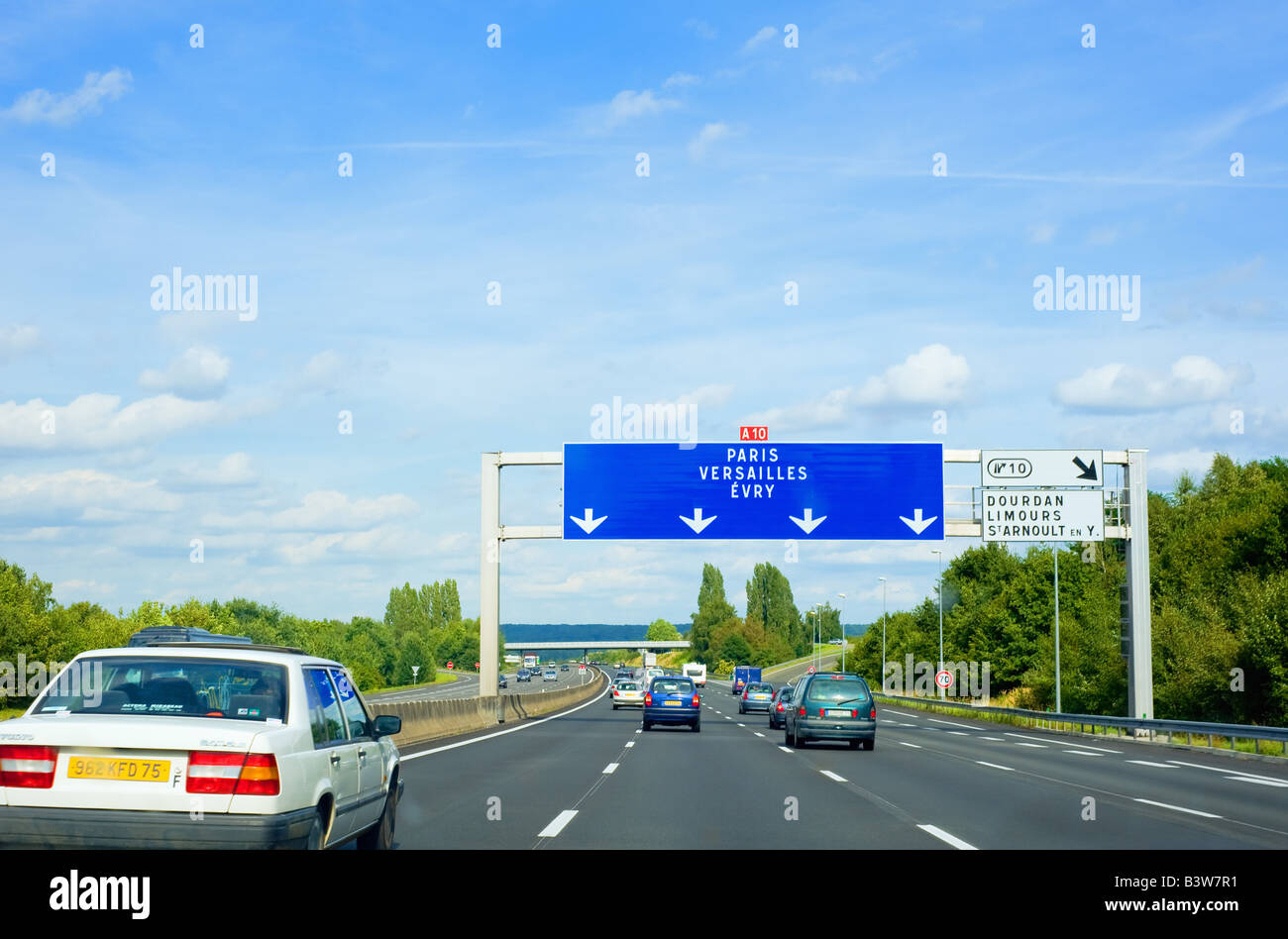 Cars and road signs on A10 highway heading to Paris, Ile-de-France ...