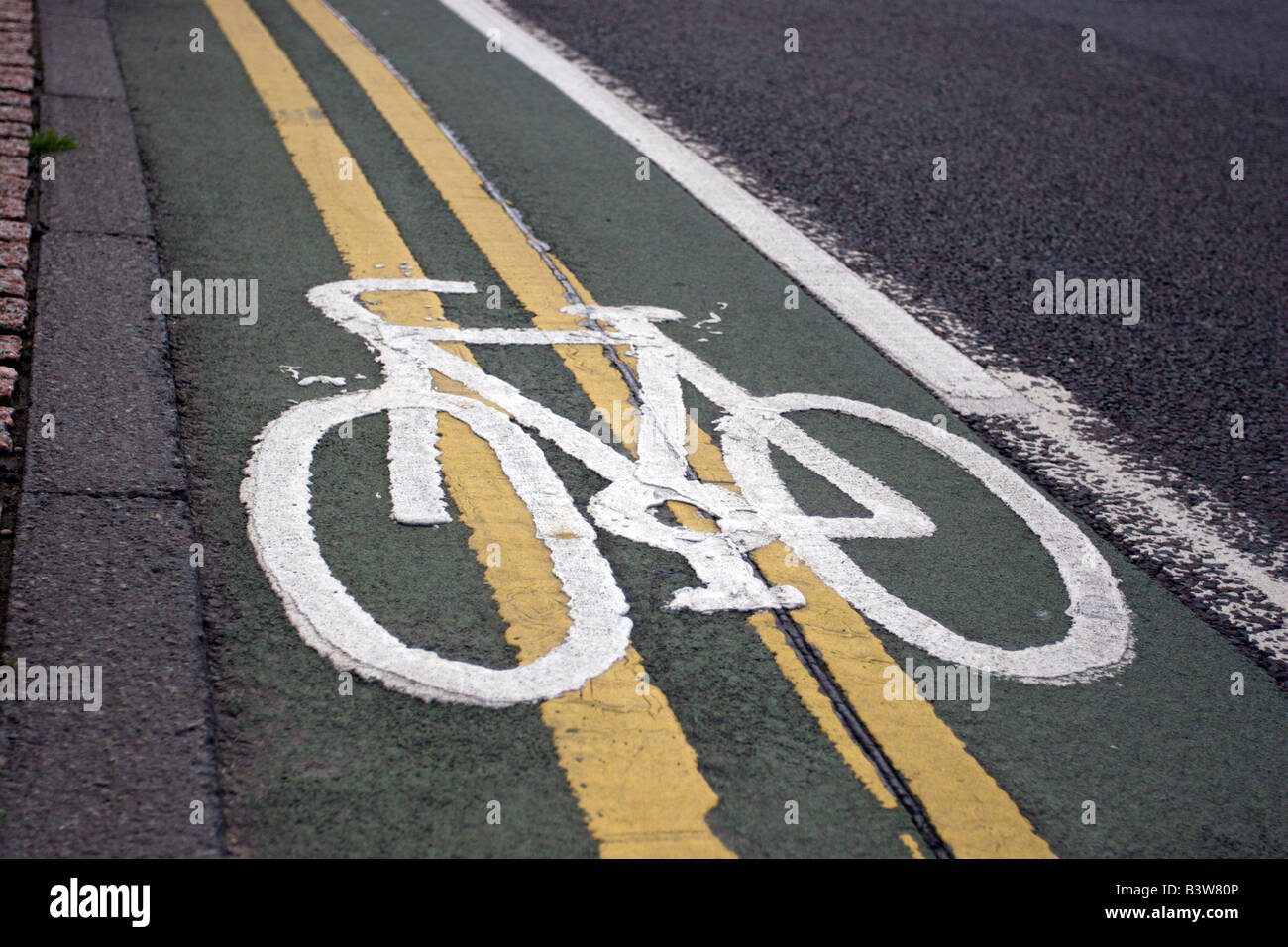Cycle lane and yellow line markings Stock Photo - Alamy