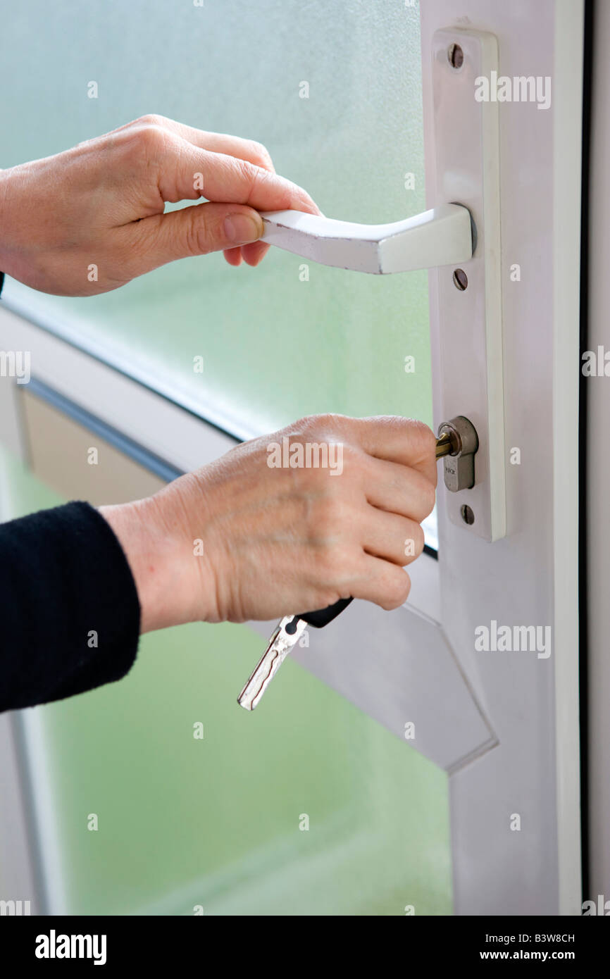 hands locking door Stock Photo - Alamy