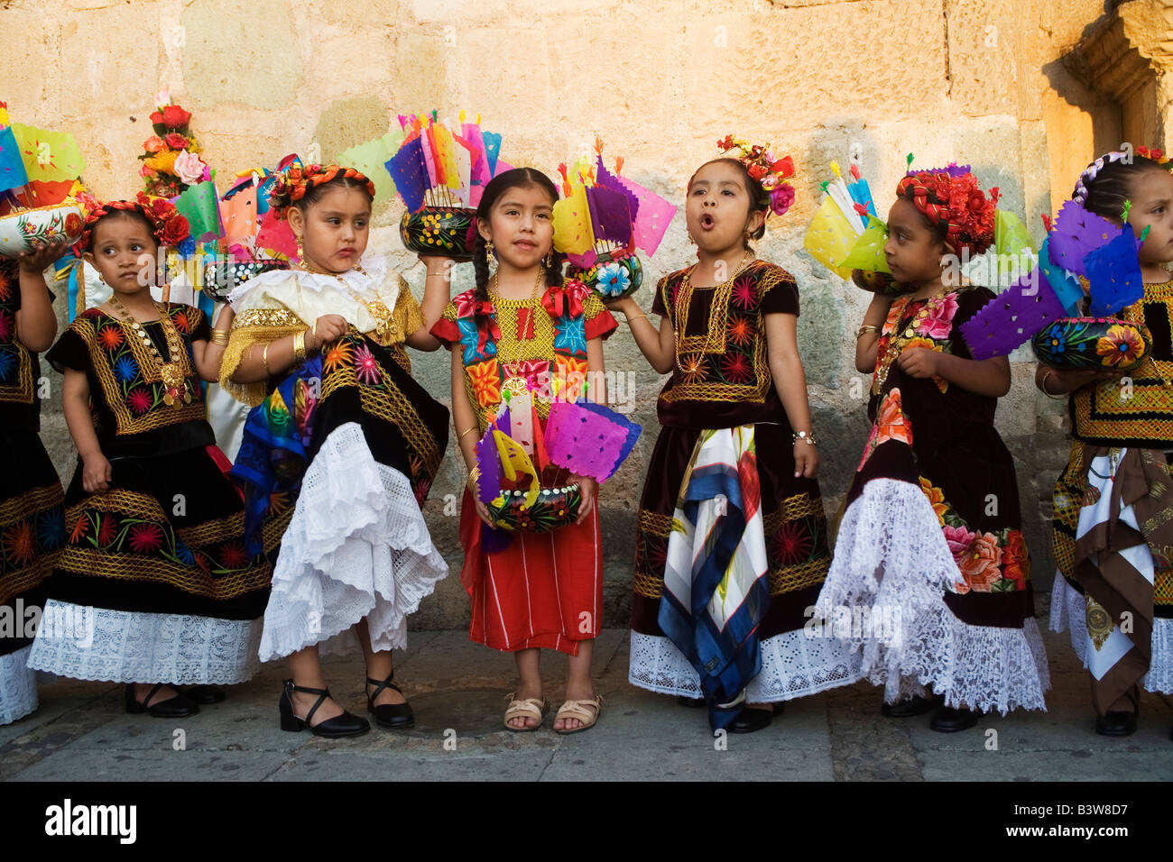 Tehuana girls are dressed up in traditional costumes during Easter ...