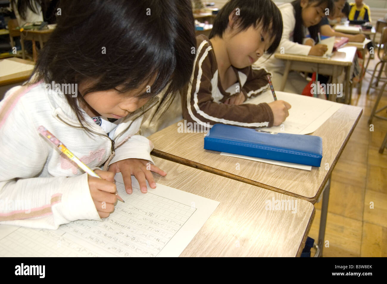 Japanese elementary students working in school Stock Photo - Alamy