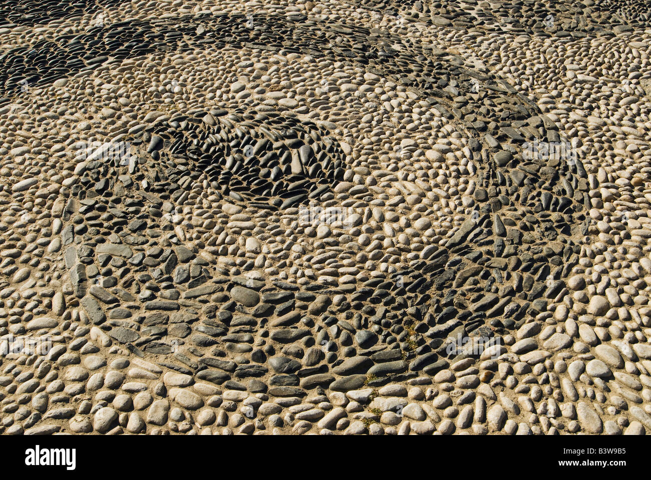 Pattern made of stones in pavement Stock Photo - Alamy