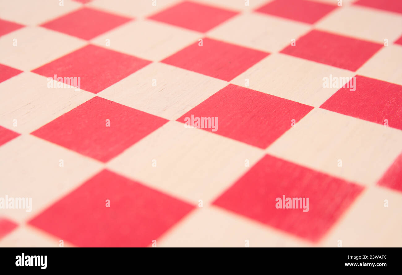 a stenciled wood checkerboard seen in perspective Stock Photo - Alamy