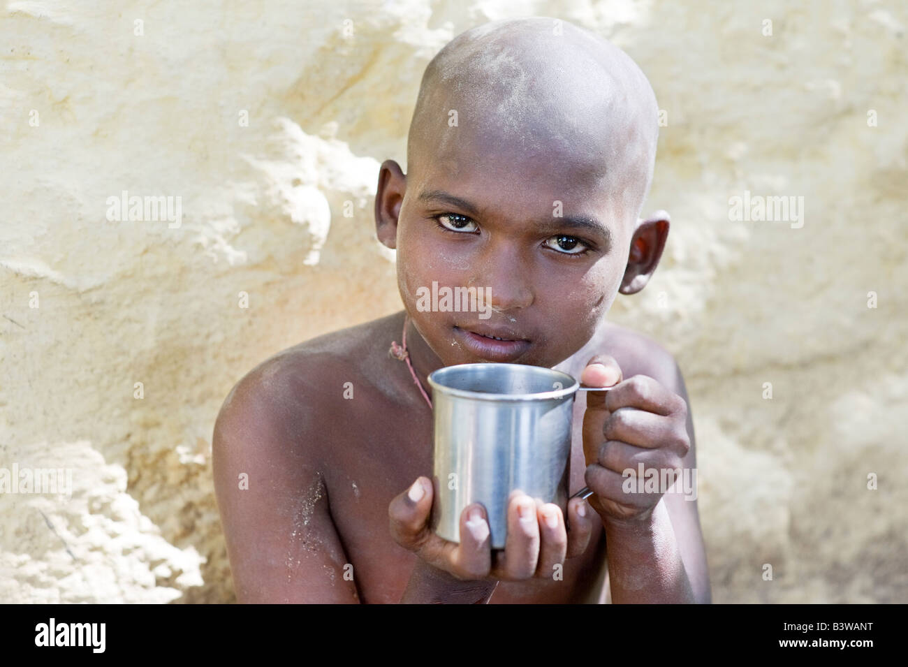 Indian boy with metal mug, drinking water. India Stock Photo - Alamy