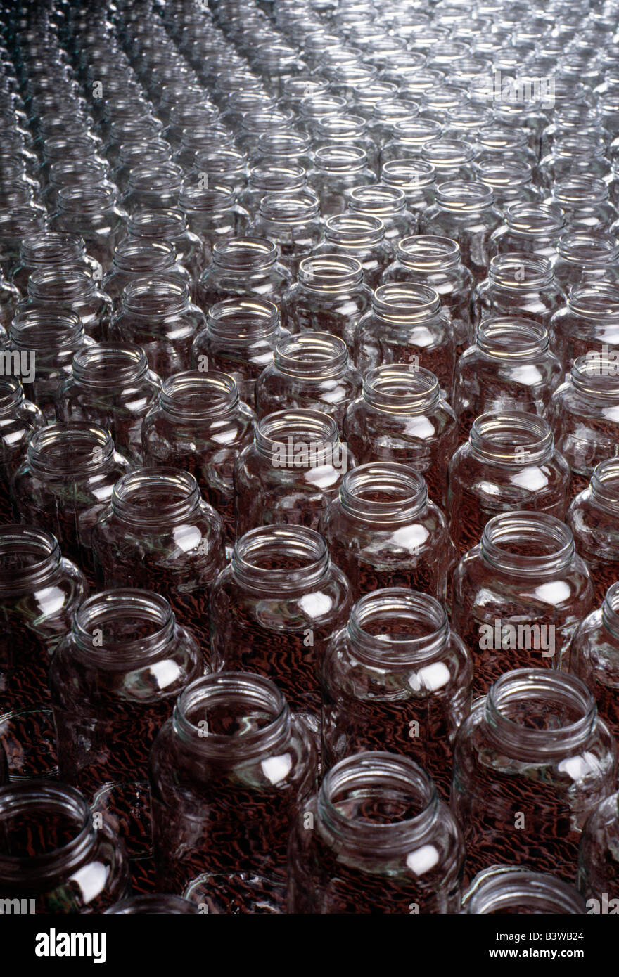 Glass bottles on the assembly line of a glass product manufacturing ...
