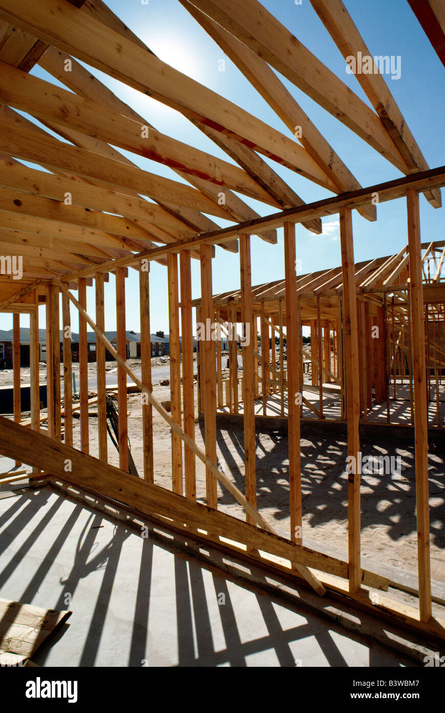Wooden studs and rafters frame a new house Stock Photo - Alamy