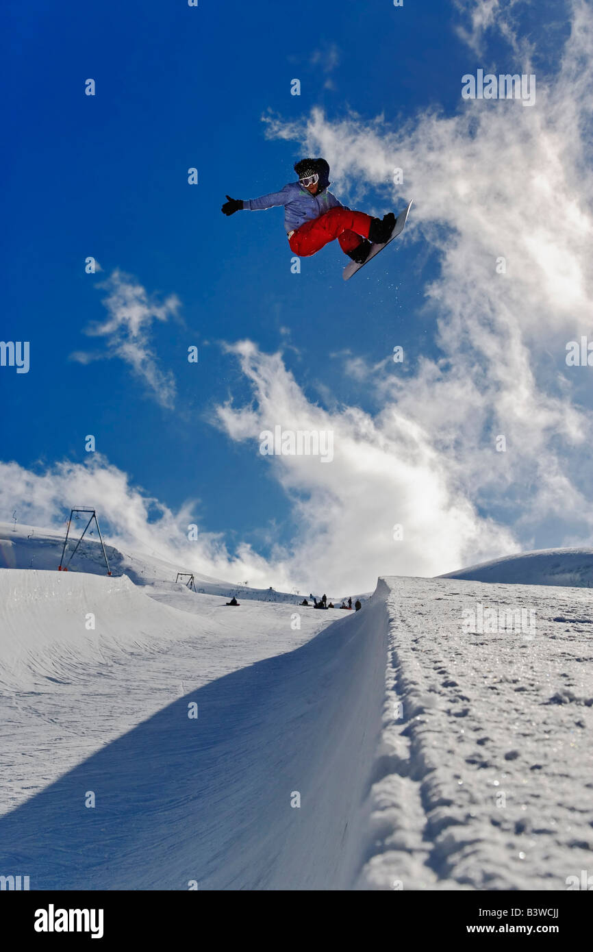 Snowboarder jumping in halfpipe, Klein Matterhorn, Zermatt, Switzerland ...