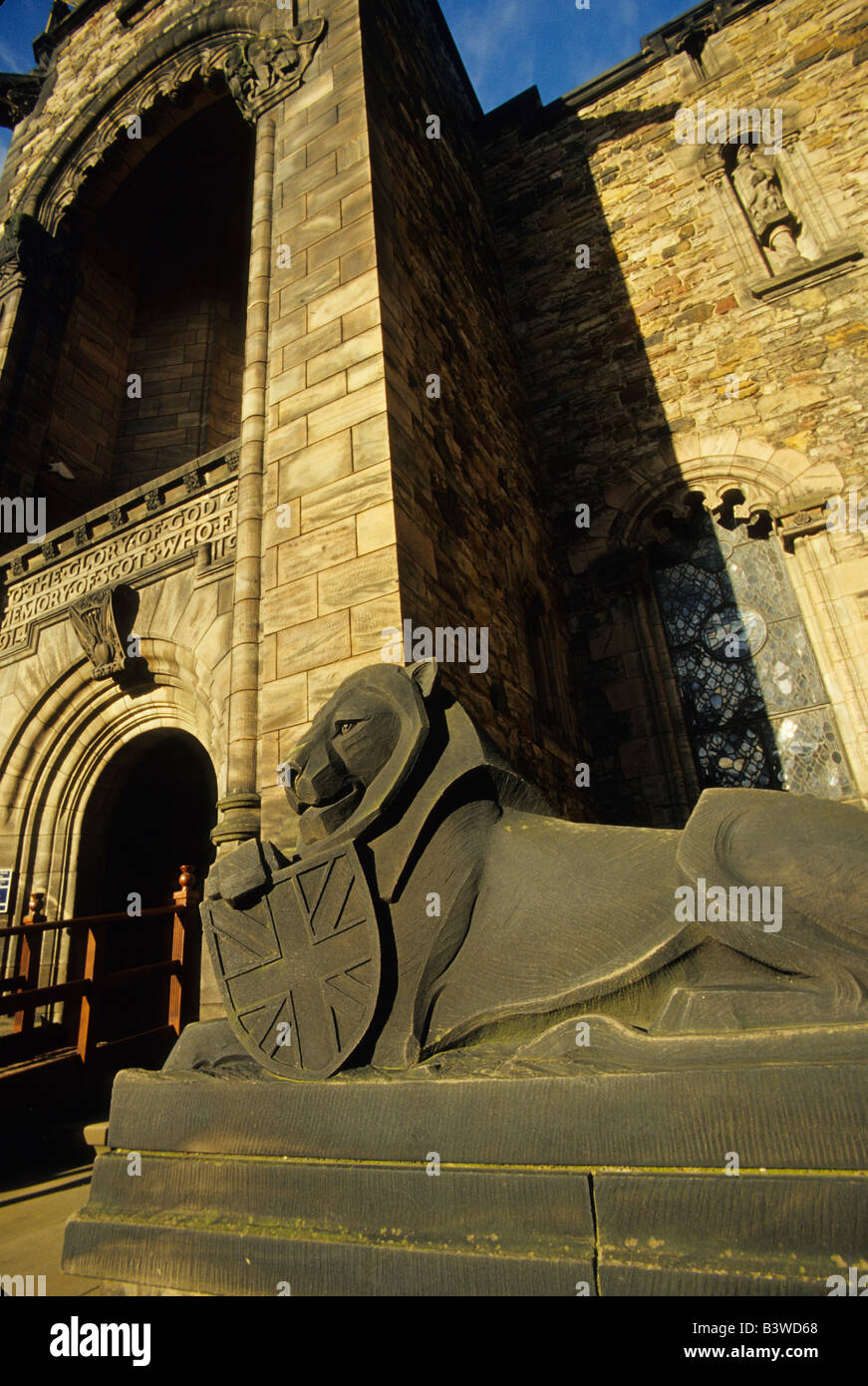 A lion with shield sculpture in front of Edinburgh Castle on Castle ...