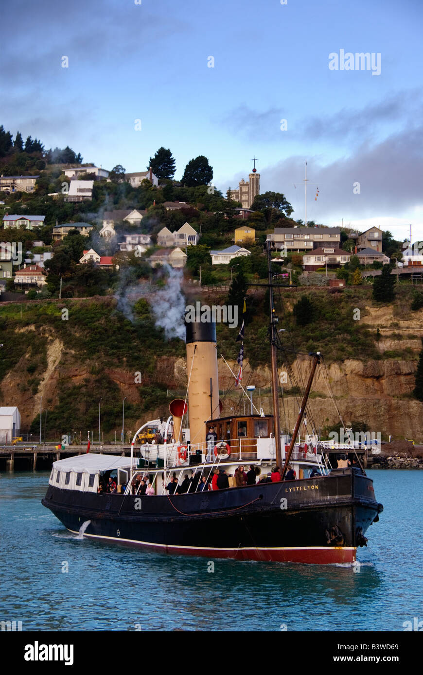 A preserved steam tug leaves port on a short excursion cruise Stock ...