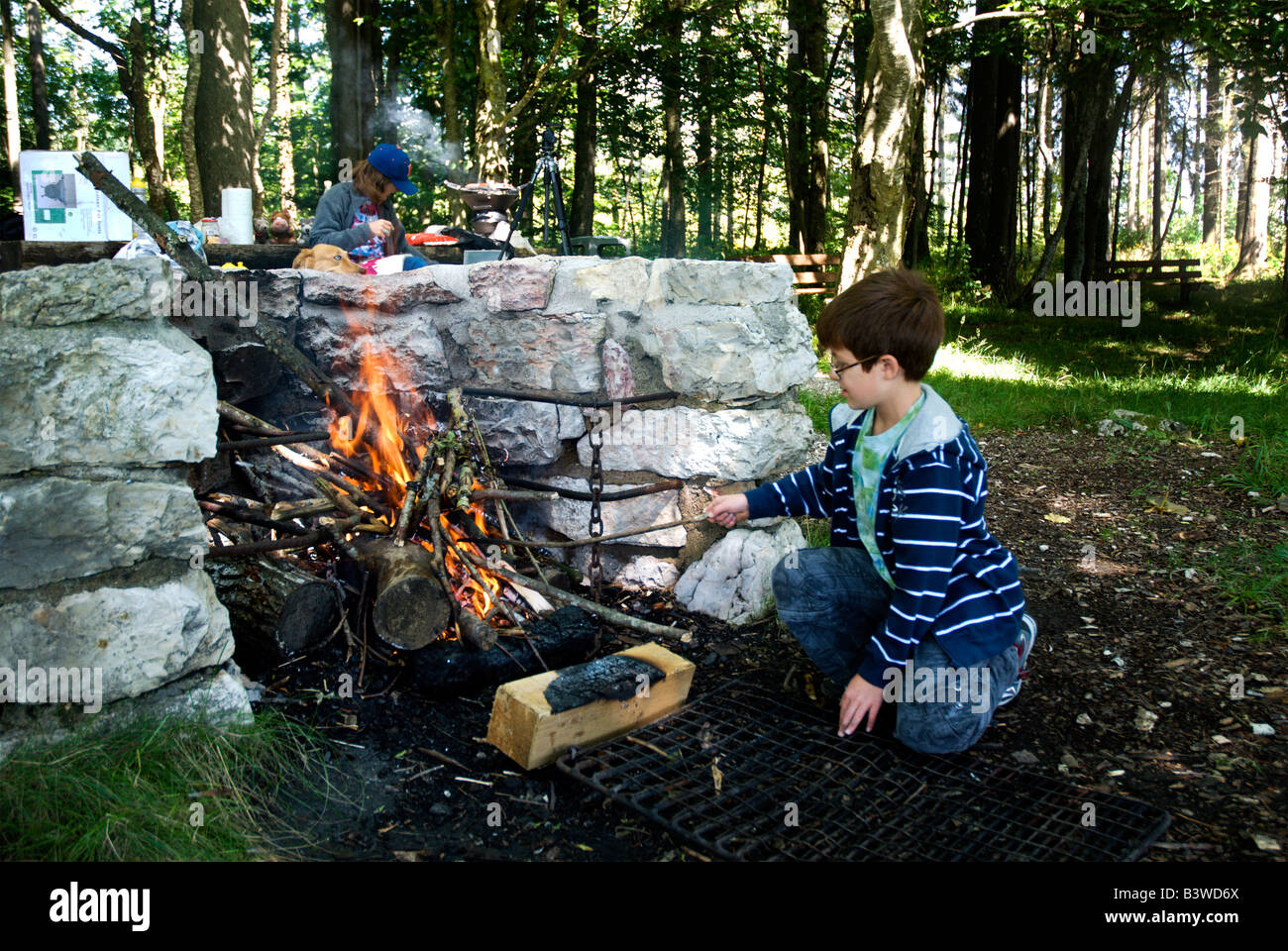 Stoking the fire hi-res stock photography and images - Alamy