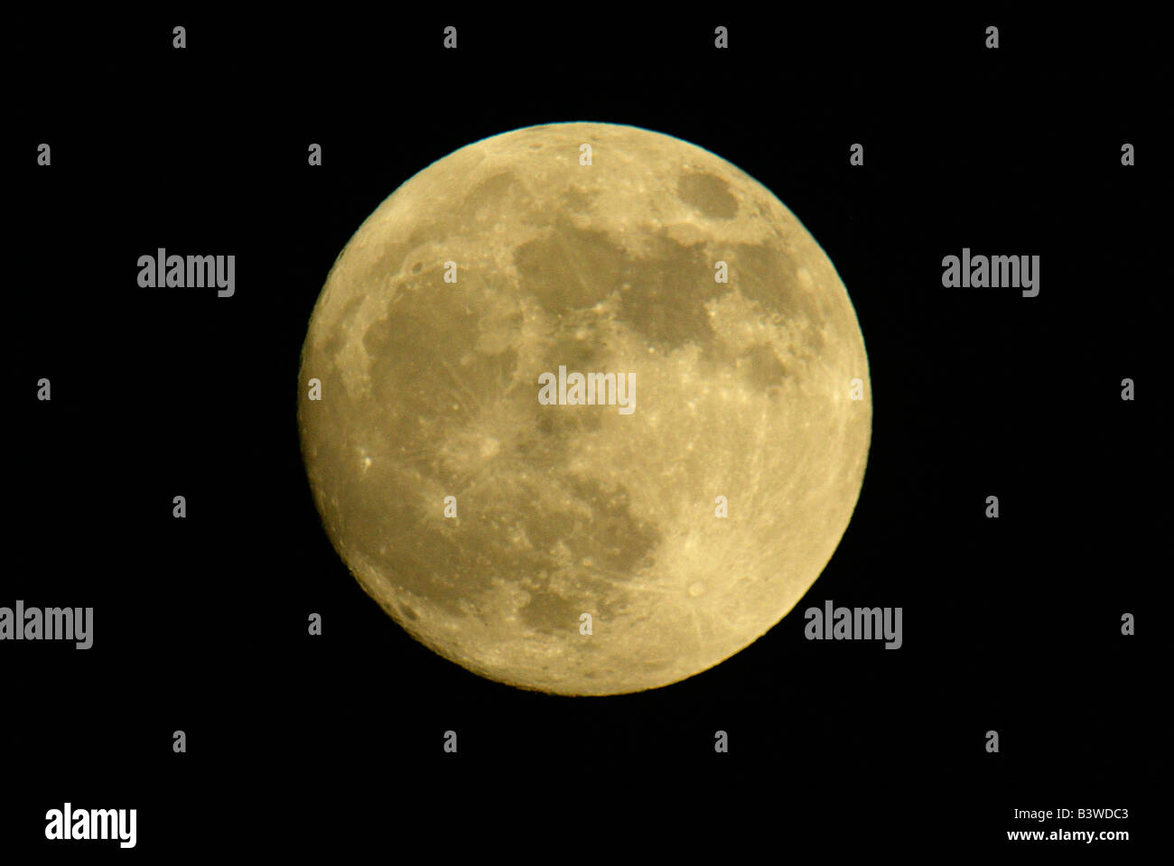 Full moon with yellowish hue Stock Photo - Alamy
