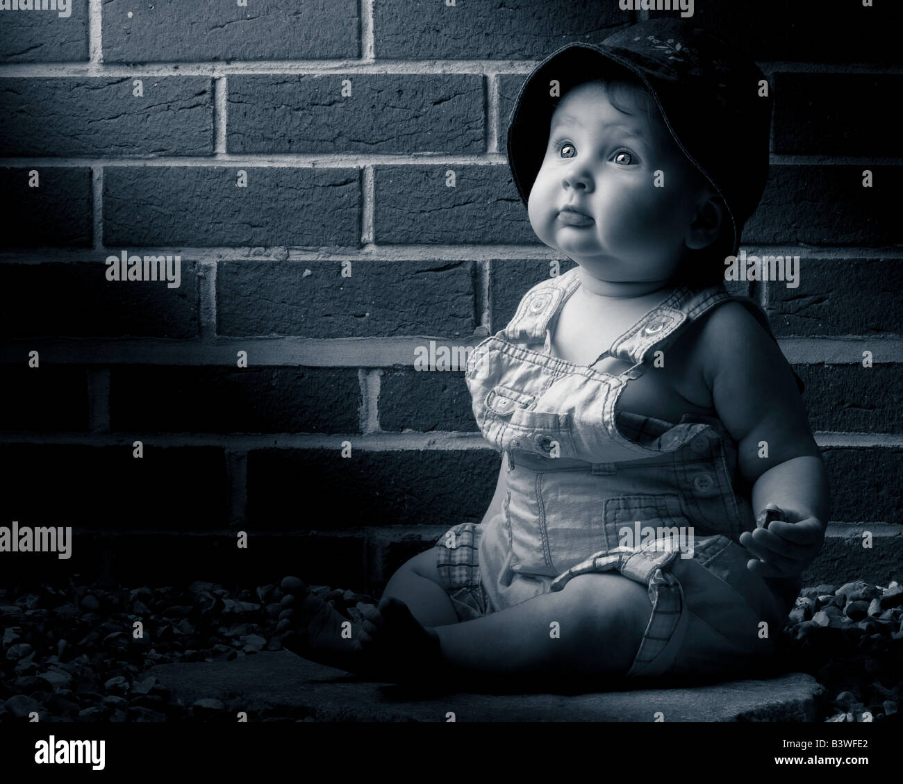 Baby in spotlight Stock Photo - Alamy