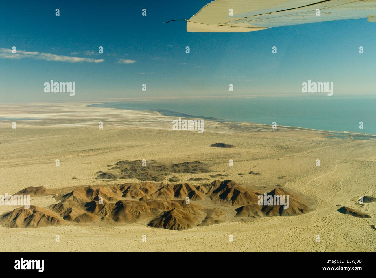 Mexico, Baja California. Salt flats and volcanic features just north of ...