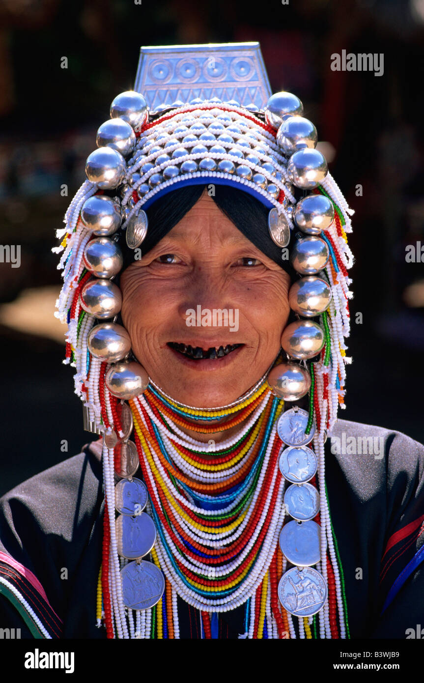 Portrait of an Akha tribal woman wearing traditional silver jewelry ...
