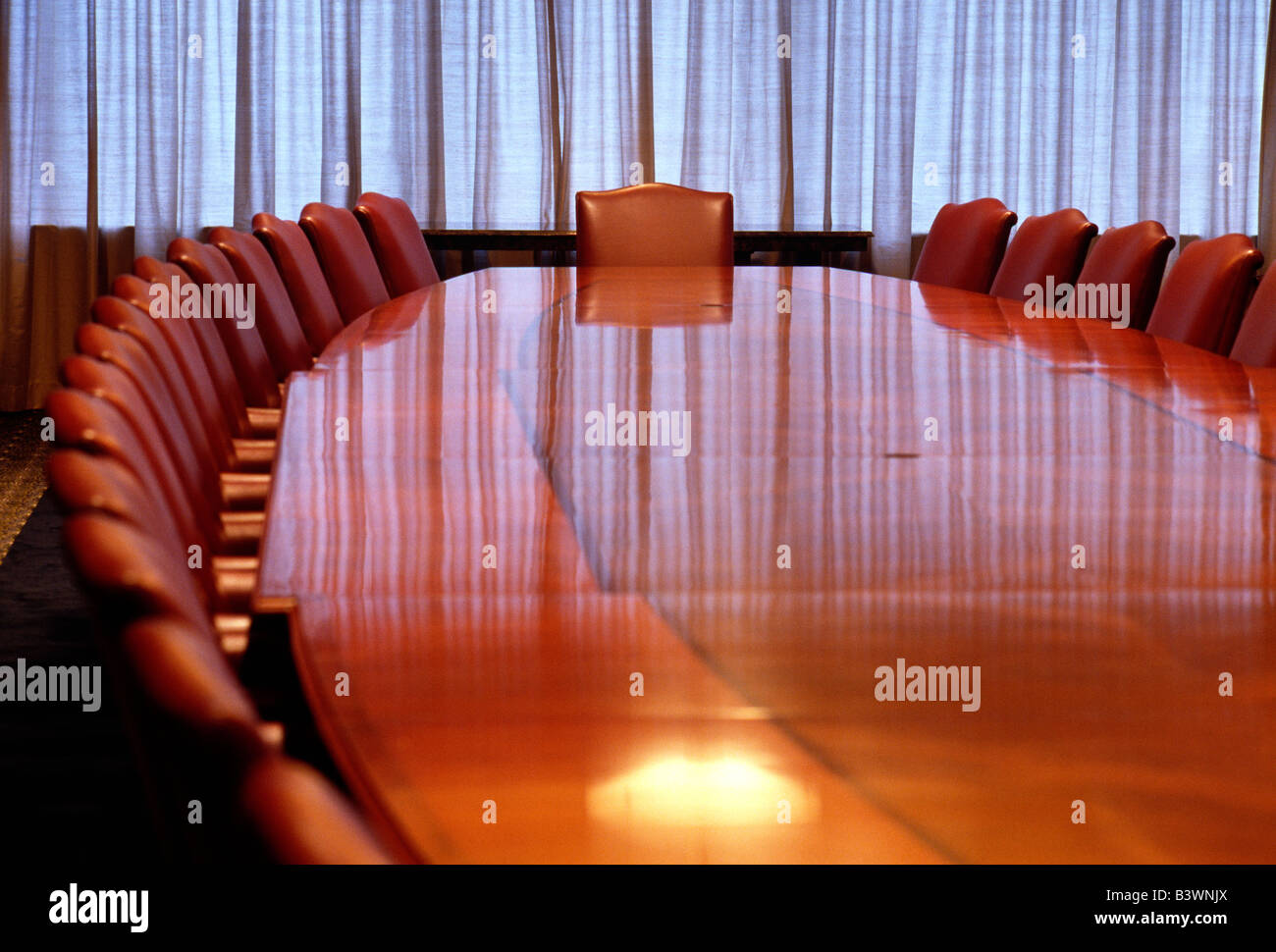 Elaborate board room table and chairs in a corporate office Stock Photo ...