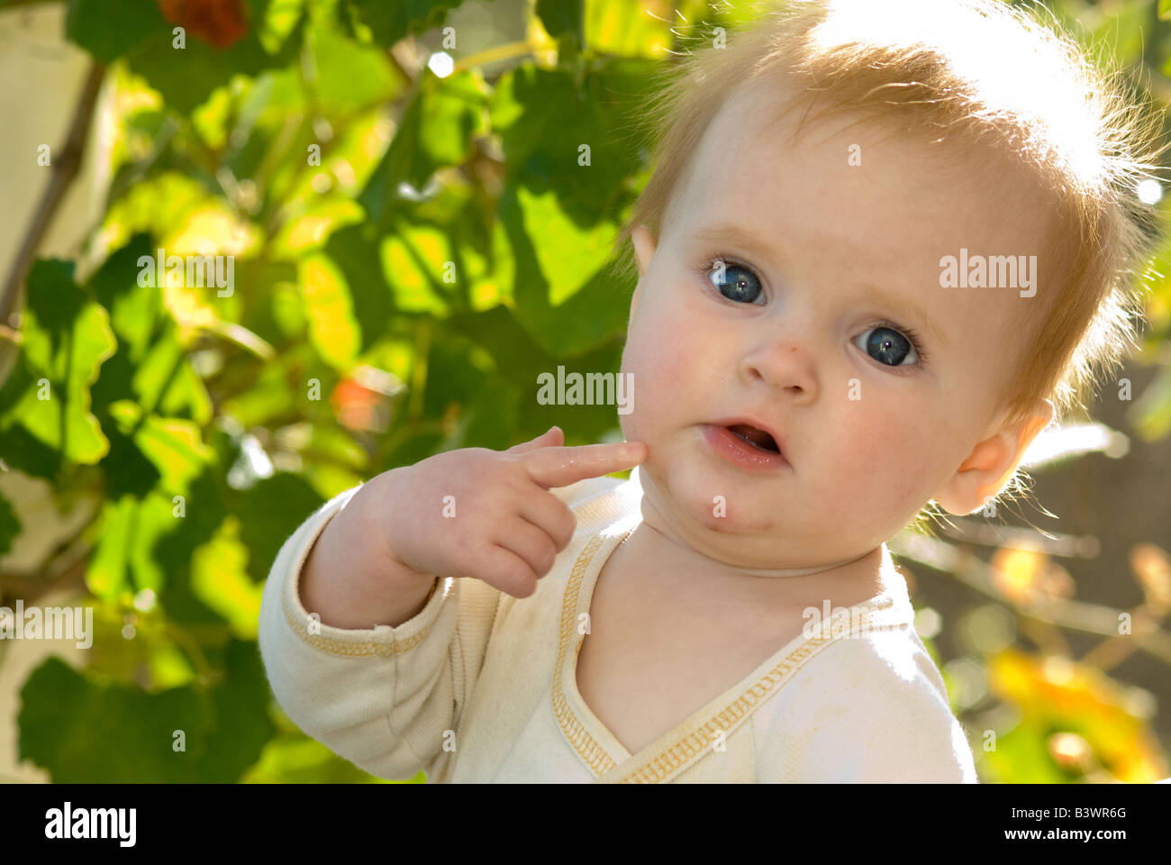child with an idea, a thought, a question Stock Photo - Alamy