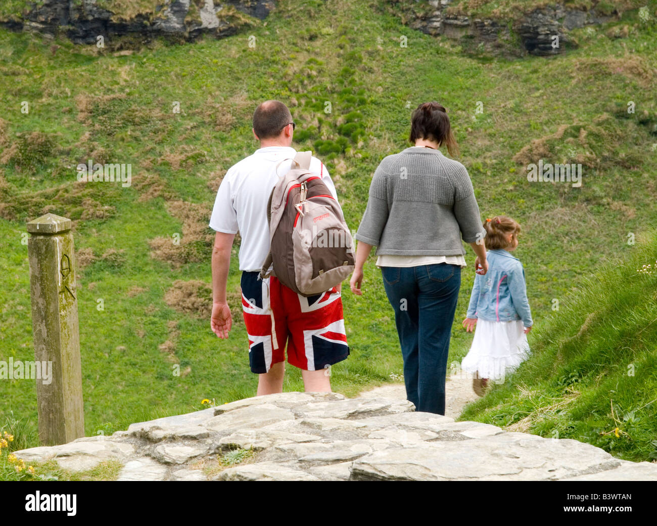 A British family enjoying a day out at Tintagel Castle in Cornwall ...