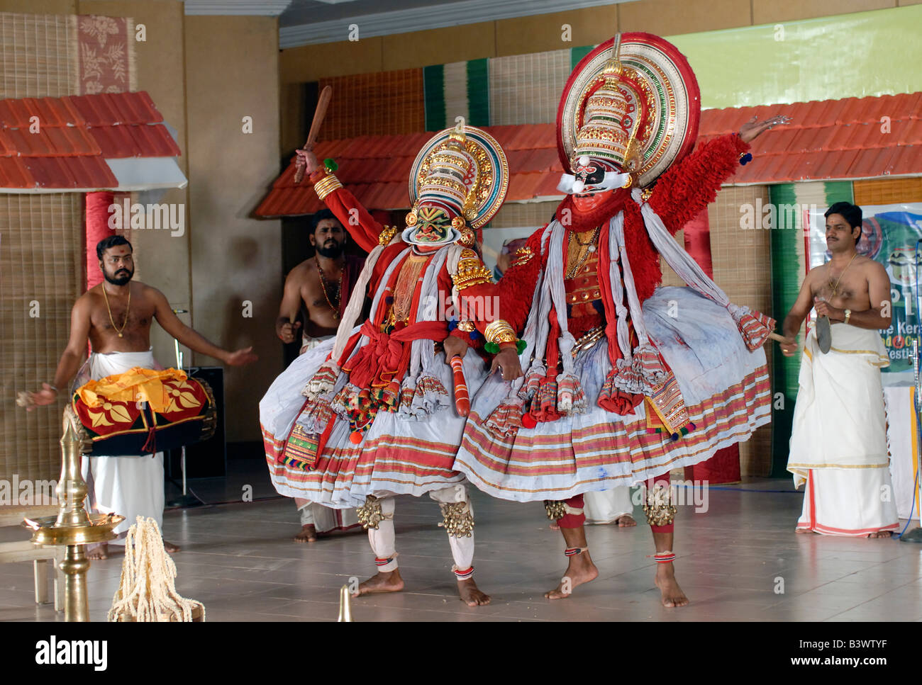 Two Kathakali dancers performing on a stage, Kerala, India Stock Photo ...