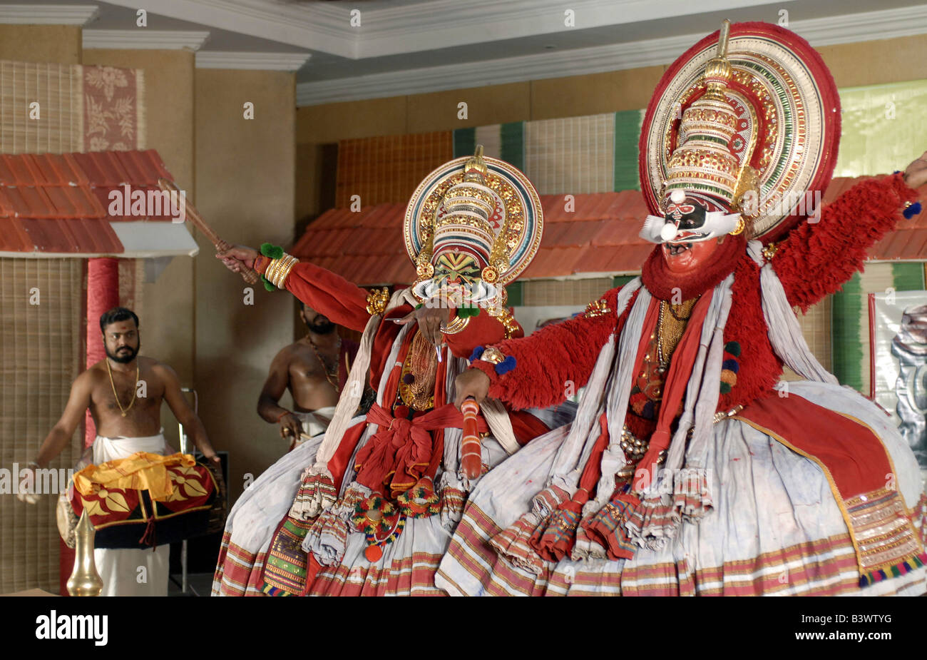 Two Kathakali dancers performing on a stage, Kerala, India Stock Photo ...