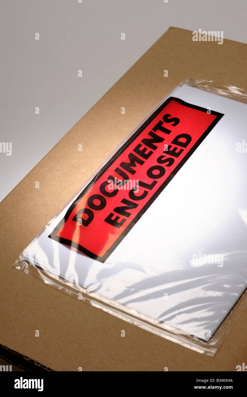Cardboard box with documents enclosed Stock Photo - Alamy